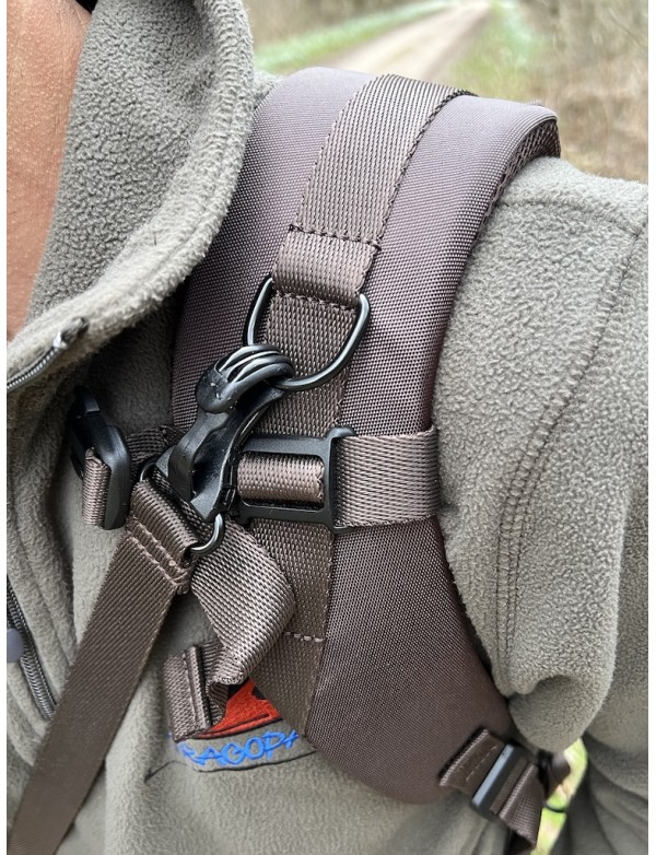 Charge-compensating camera sliding strap