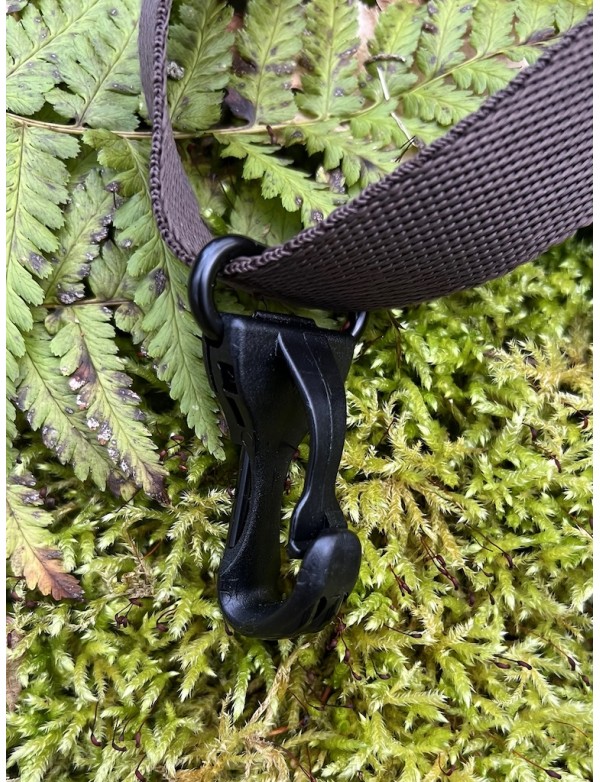 Charge-compensating camera sliding strap